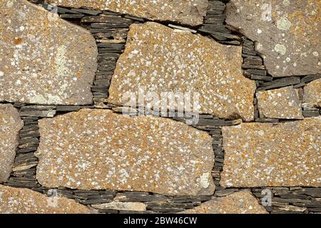 Large section of hand laid sandstone wall, dry wall construction ...