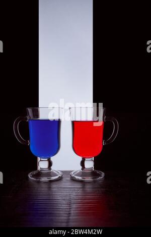 unlabeled vodka bottle with two glasses on a background of wooden ...