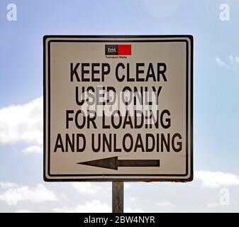 MALTA road sign against clear blue sky Stock Photo - Alamy