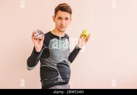 Portrait of man choosing fast food in food truck in the street. Meal ...
