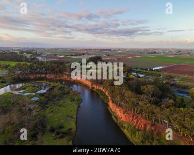Aerial view of farmland, river, and cliffs in eastern South Dakota, USA ...