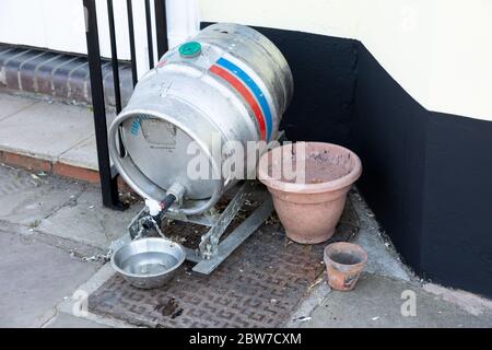 Beer keg used as a water container for dogs, outside a pub UK Stock ...