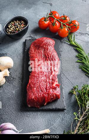 Roast Tri Tip or sirloin bottom beef steak on a plate with arugula ...