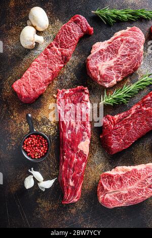 Raw organic machete or skirt steak on a butcher knife . Dark background ...