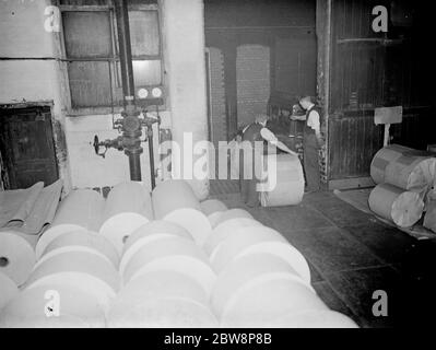 Olive and Partington Paper Mill , Manchester . Loading the paper rolls ...