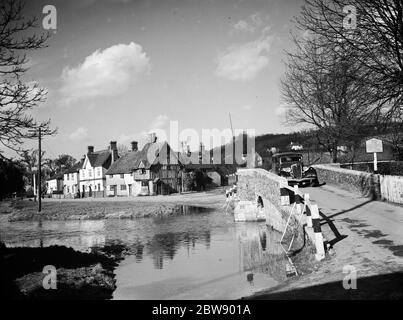 A ford over the river Darent, with a picturesque hump-back bridge ...
