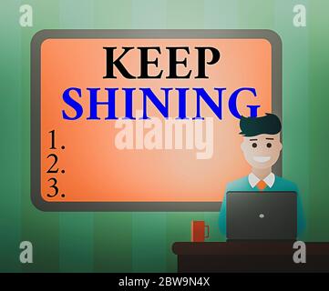 Photo of amazed charming happy man look empty space hold red paper ...