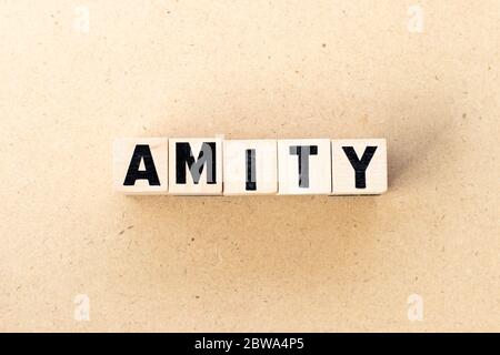 Wood letter in word amity on green grass background Stock Photo - Alamy