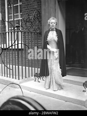 Prime Minister Neville Chamberlain steps off a plane wearing an ...