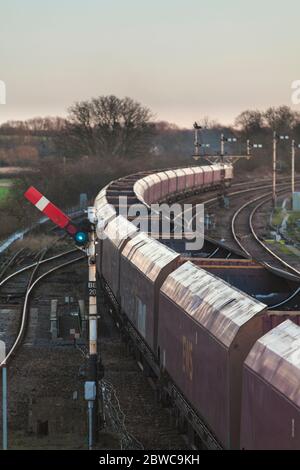 Class 66 diesel locomotive 66155 with train of empty wagons, passing ...
