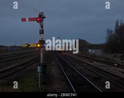 Semaphore distant railway signal with a approaching train at Barnetby ...