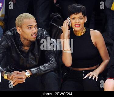 Rihanna, Chris Brown laughing together at LA Lakers NBA game, December ...