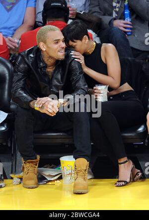 Rihanna, Chris Brown laughing together at LA Lakers NBA game, December ...