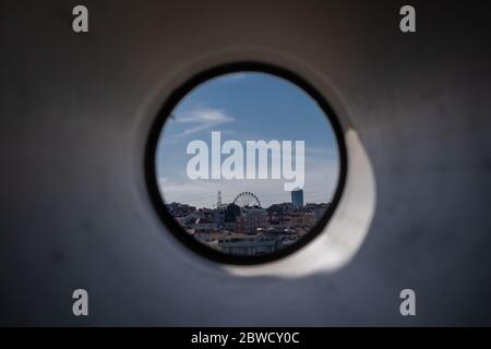Look at the ferris wheel through the plastic pipe Stock Photo - Alamy
