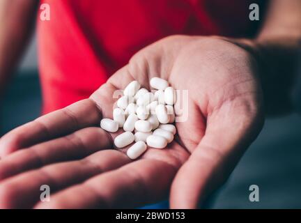 Man's hand holding mint chewing gum on hand and show it on camera ...
