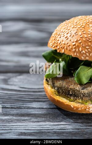 tasty vegan burger with microgreens served on wooden table Stock Photo ...