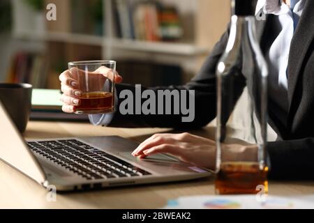 Close up of drunk entrepreneur woman lying over desk on coronavirus ...