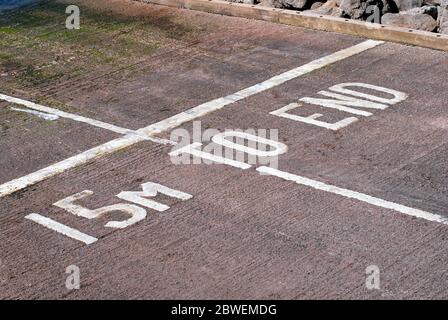 Warning sign, in large letters, on boat launching ramp '15m to end ...