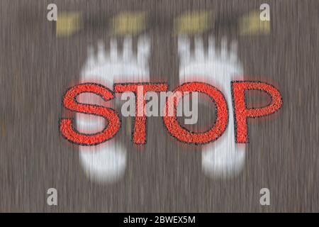 Stop sign with blurred footprints on pavement at Poole, Dorset UK in ...