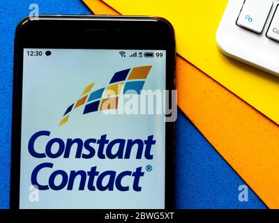 In this photo illustration of the Constant Contact logo seen displayed ...