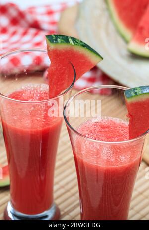 Glasses of fresh watermelon juice on color background Stock Photo - Alamy