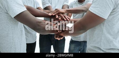 group of diverse guys making a tower out of hands Stock Photo - Alamy