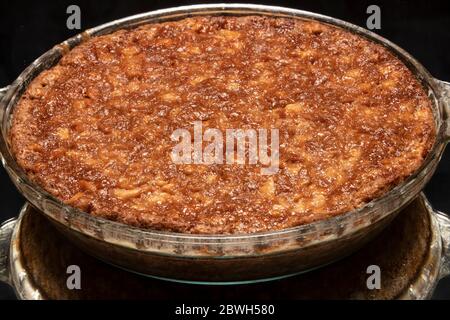 apple cake in round glass baking dish on mirror Stock Photo - Alamy