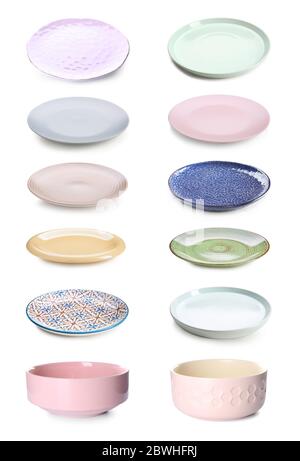 Different plates with bowls on white grunge background Stock Photo - Alamy