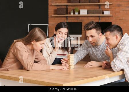 Team of business people playing jenga in office Stock Photo - Alamy