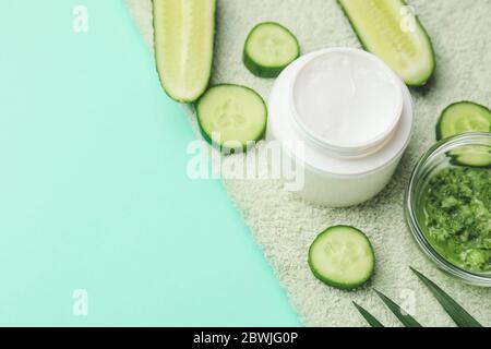 Cream with cucumber extract on color background Stock Photo - Alamy