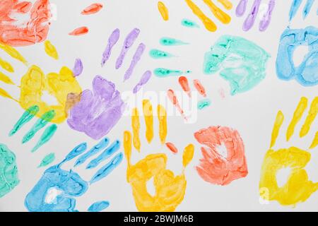 Colorful human palm prints on white background Stock Photo - Alamy
