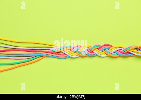 Braided ropes on color background Stock Photo - Alamy