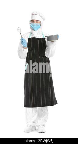 Housewife in protective costume cooking in kitchen Stock Photo - Alamy