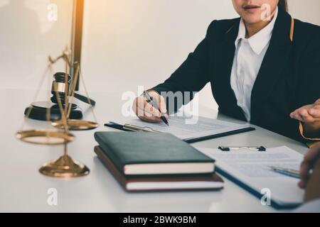 Lawyer is giving advice to clients who have consulted about legal ...