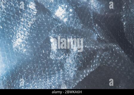 A closeup shot of blue bubble wrap, selective focus Stock Photo - Alamy