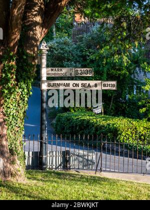 A traditional English "fingerpost" directions sign stands in the ...