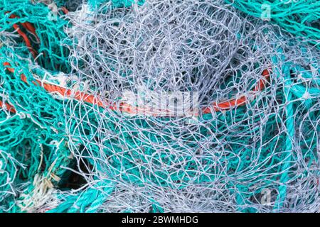 Fishing nets lying in a heap Stock Photo - Alamy