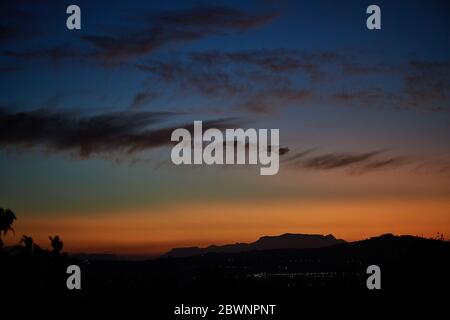 Sunset over Table Mountain and Bottelary Hills Stock Photo - Alamy