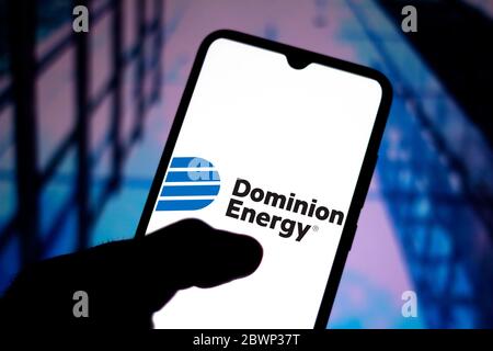 In this photo illustration a Dominion Energy logo seen displayed on a ...