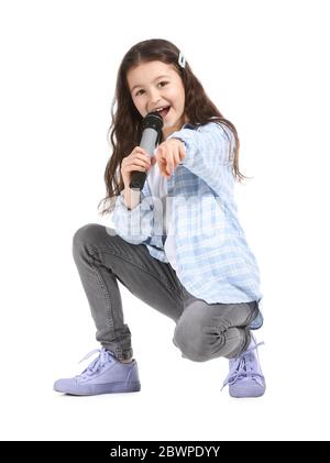 Cute little girl singing karaoke at home Stock Photo - Alamy