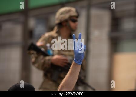 National Guard troops stand guard over paint peeling off the bottom of ...