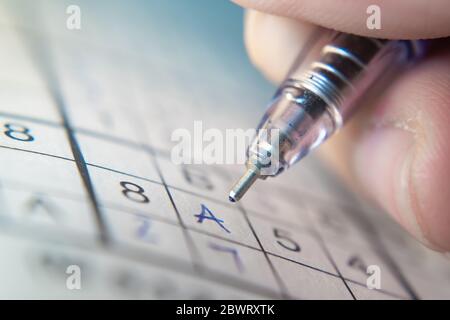 Writing on Sudoku puzzle with ballpoint pen Stock Photo - Alamy