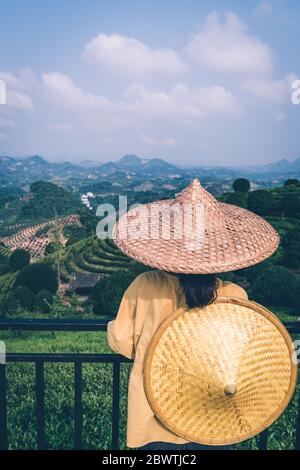 A closeup of a beautiful girl leaning on the car on a sunny day Stock ...
