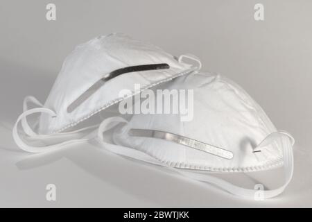 Closeup of medical face masks isolated on magenta colored background ...