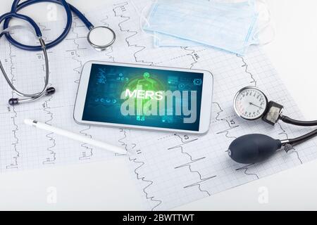 Tablet pc and doctor tools with MERS inscription, coronavirus concept ...
