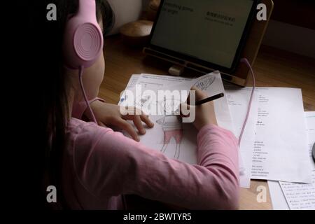 girl drawing picture at desk at home Stock Photo - Alamy