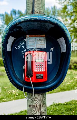 Vintage concept. Woman with payphone. Communication. Oldstyled city ...