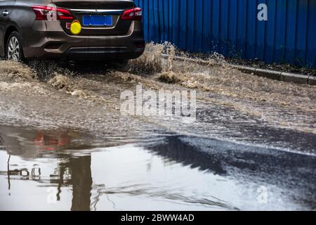 dirty water splash after vehicle roaring by Stock Photo - Alamy