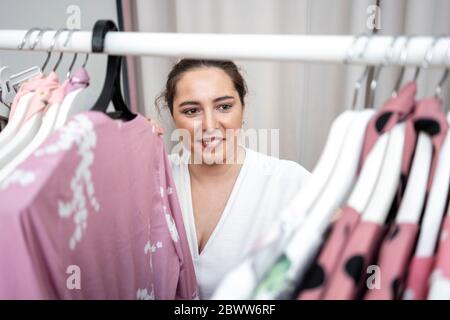 Seamstress sewing and working with fabrics in workshop Stock Photo - Alamy
