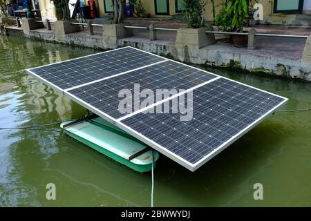 Solar Cell Panel Paddle Wheel Aerator in city park pond Stock Photo - Alamy